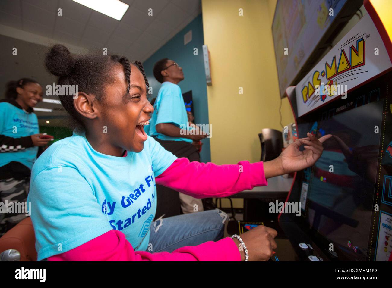 IMAGE DISTRIBUTED FOR AARON'S- Kayla plays Pac-Man during the unveiling ...