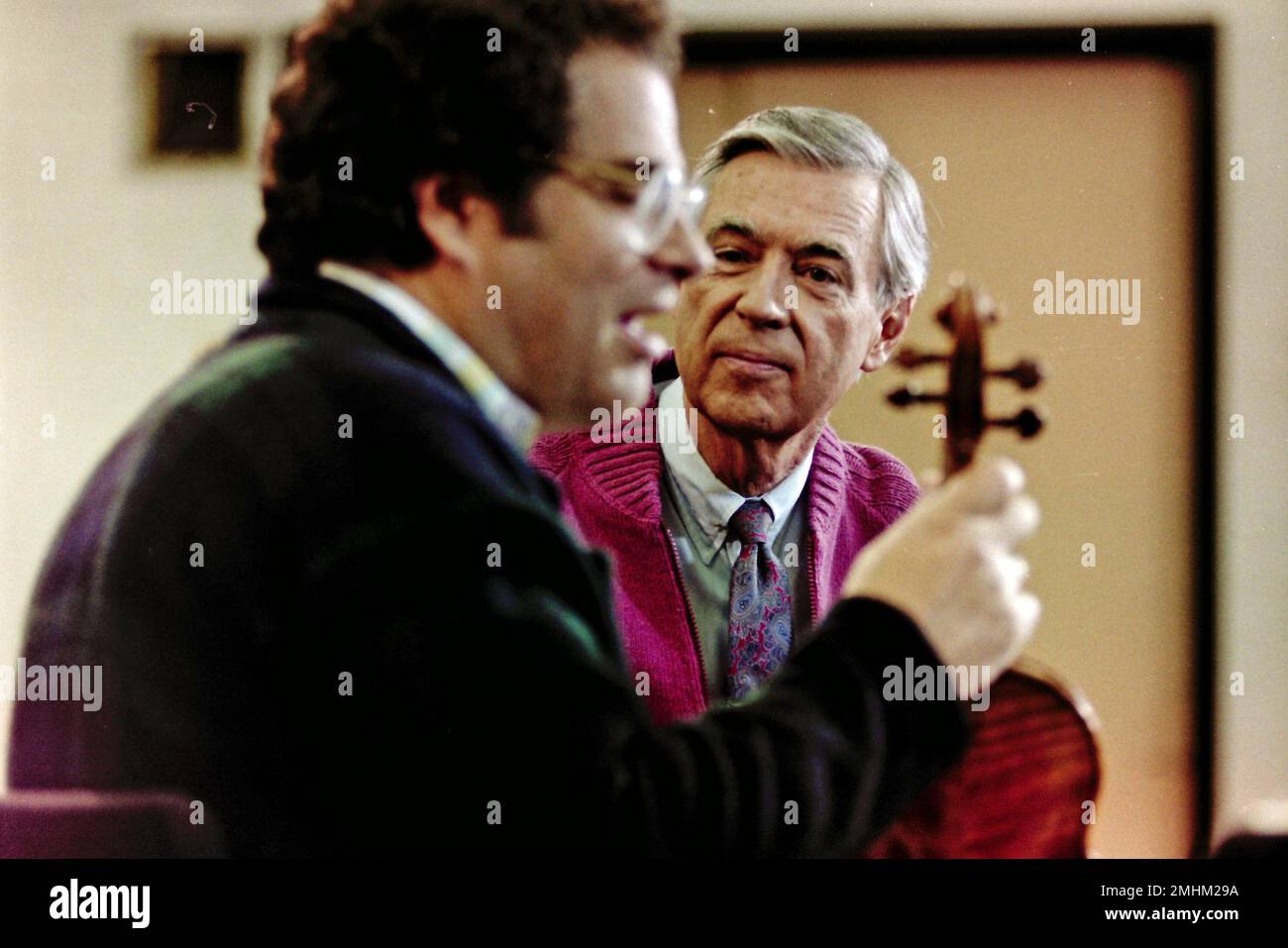This April 13, 1993 file photo shows Fred Rogers, right, visiting with ...