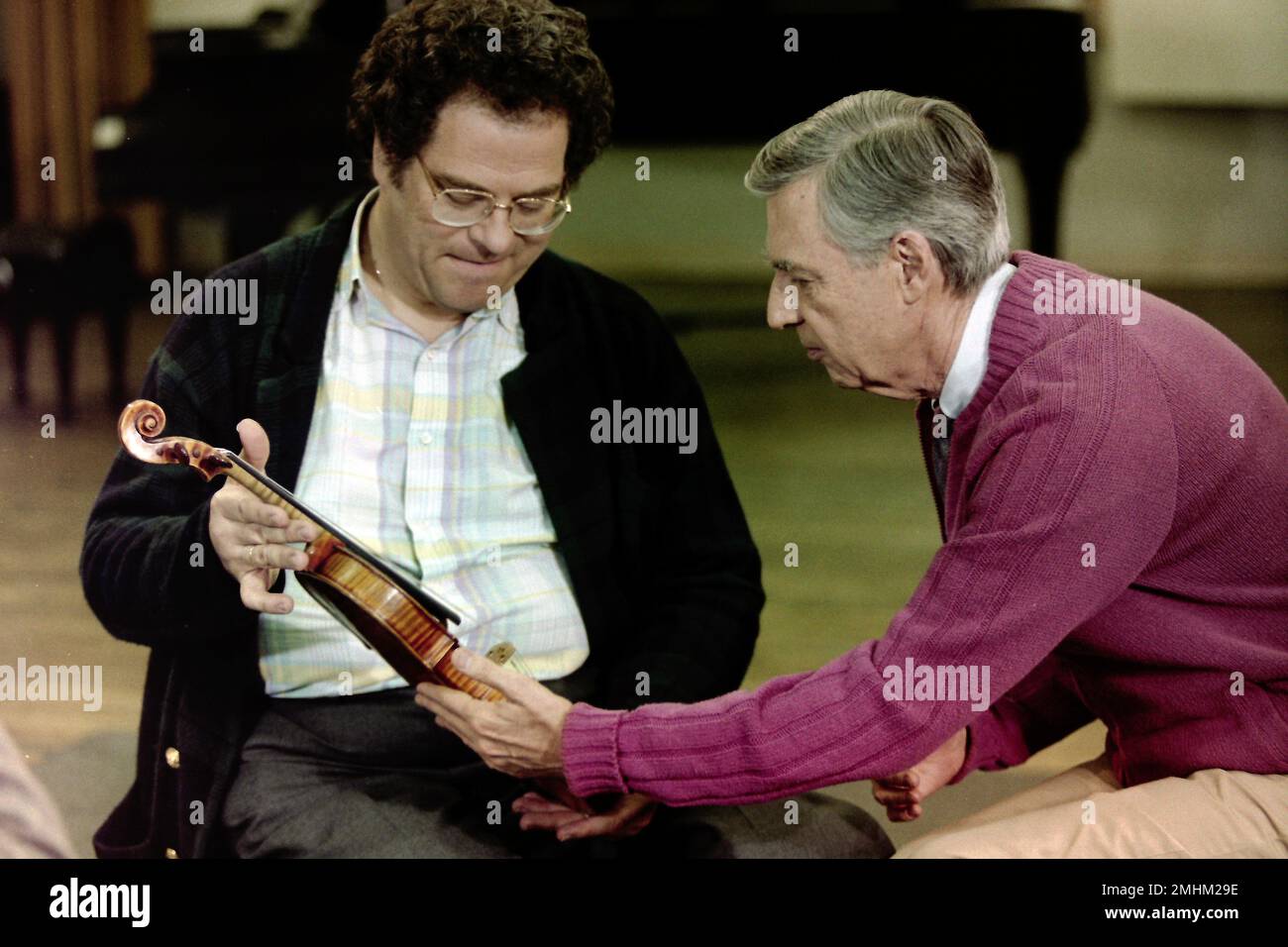 This April 13, 1993 file photo shows Fred Rogers, right, visiting with ...