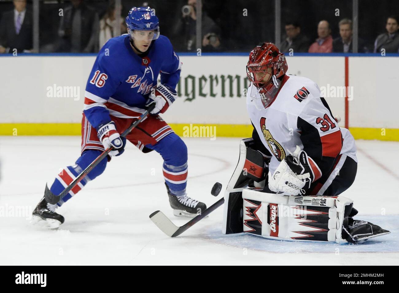 Ottawa Senators goaltender Anders Nilsson (31) stops a shot on goal by New York Rangers' Ryan ...