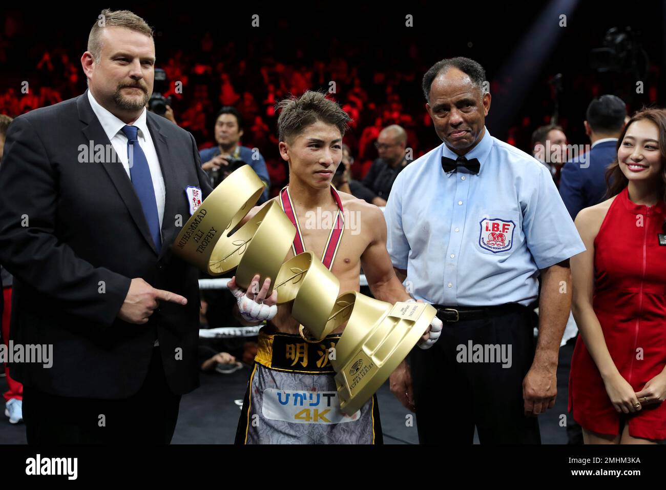 Japan's Naoya Inoue holds the Muhammad Ali Trophy after winning the ...