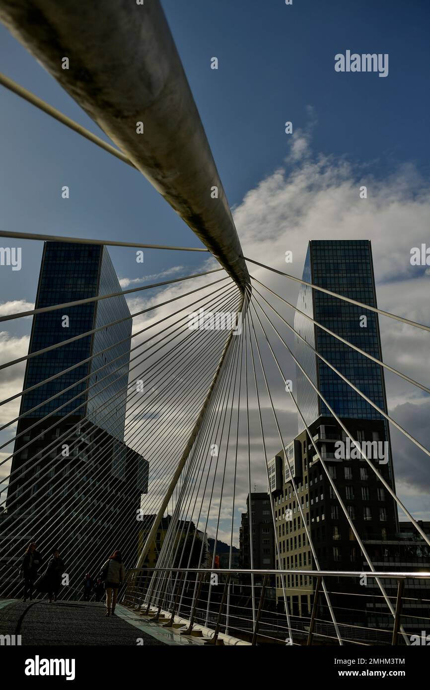 People cross the Calatrava bridge over Bilbao's Estuary, in Bilbao ...
