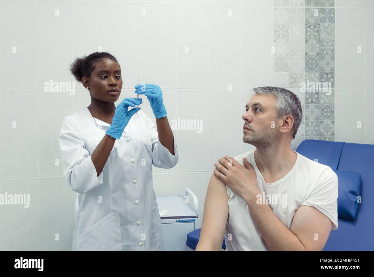 Young doctor holds injection coronavirus hi-res stock photography and ...