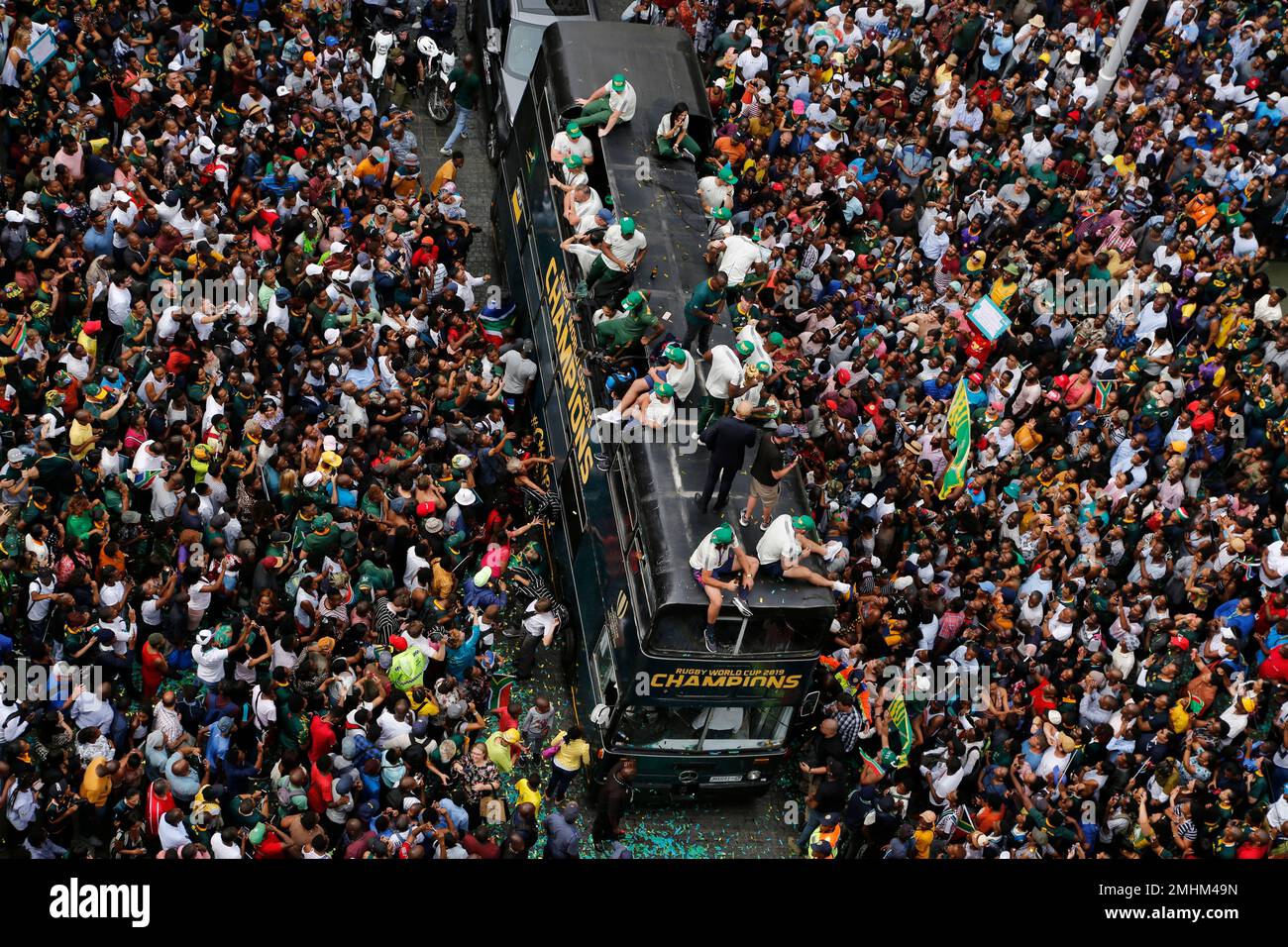 Rugby fans surround the bus of the South African Springbok rugby team ...