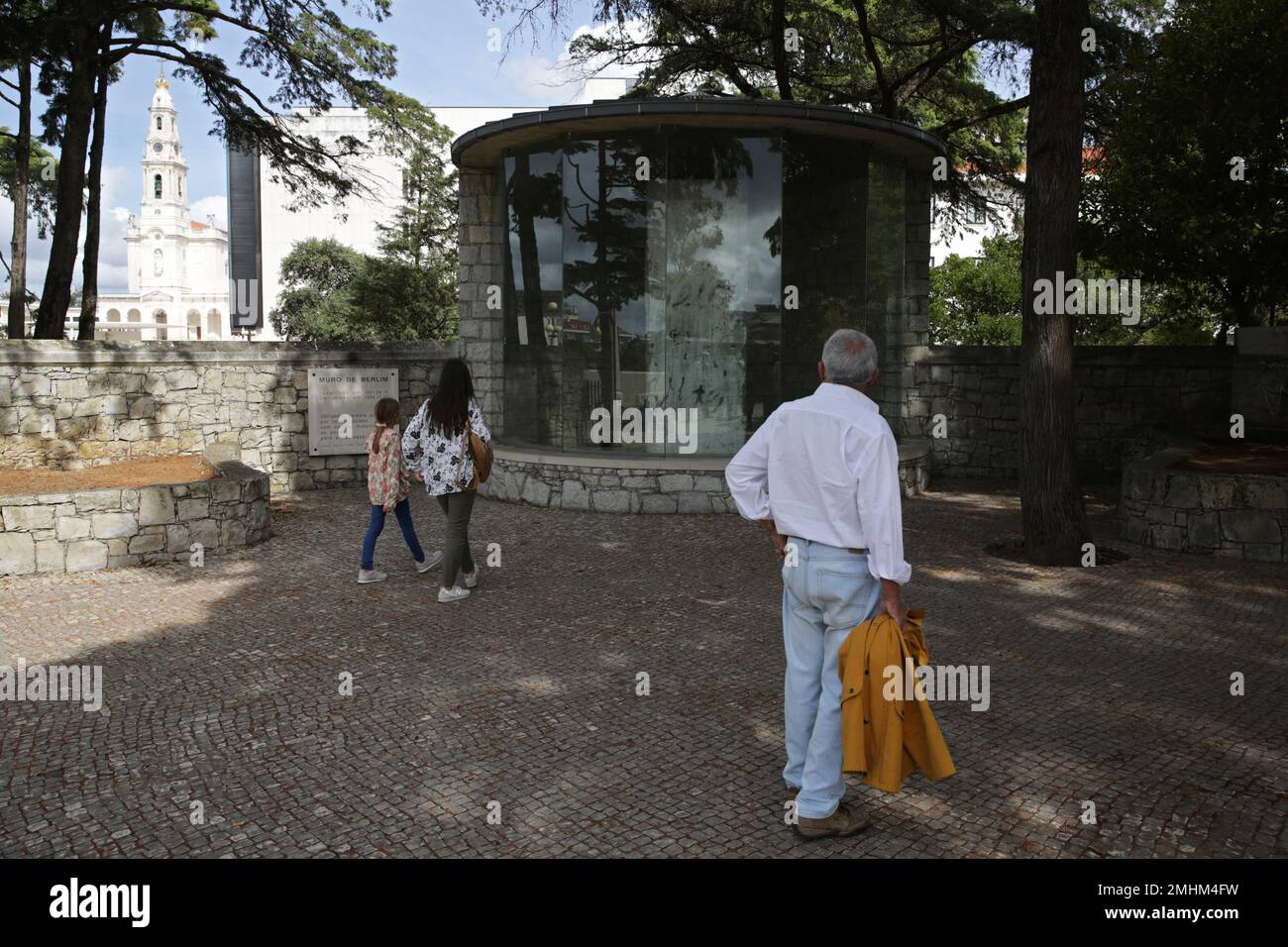 In this picture taken Sept. 22, 2019, people look at a piece of the ...