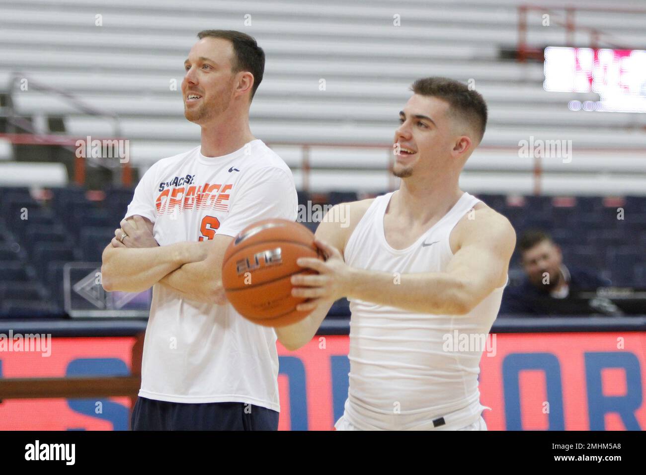 Syracuse's assistant coach Gerry McNamara, left, and Syracuse's Joseph ...
