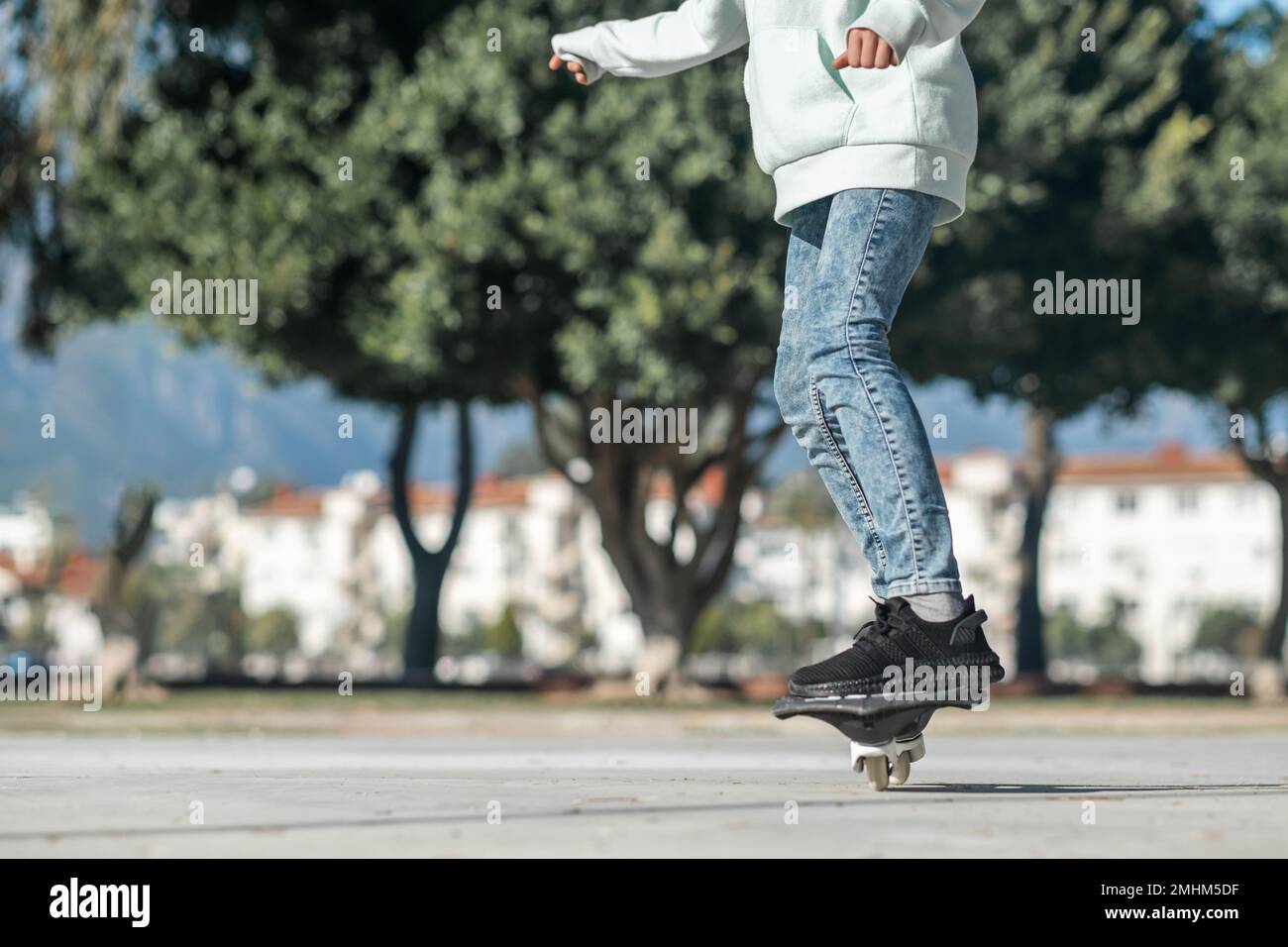 waveboard skater, Girl holds casterboard with two wheels, modern street ...