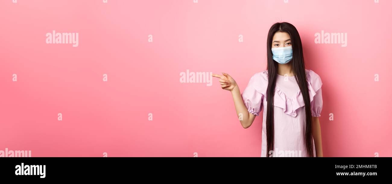 Covid-19, pandemic lifestyle concept. Cute asian teen girl in medical ...