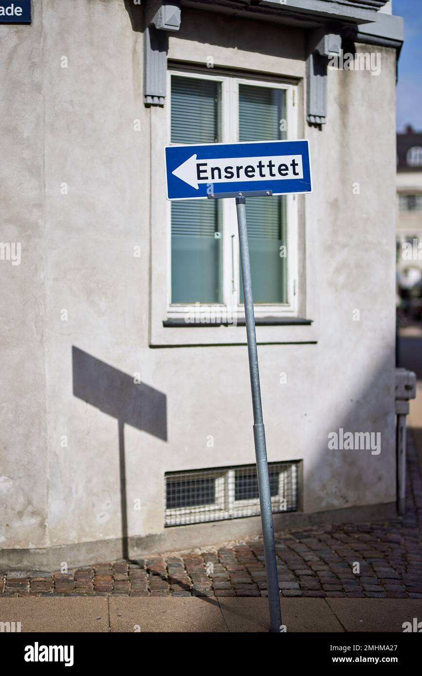 "Ensrettet" sign (Danish: "one-way street") on street corner ...