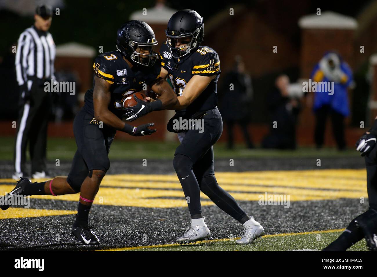 Appalachian State quarterback Zac Thomas (12) hands off to running back ...