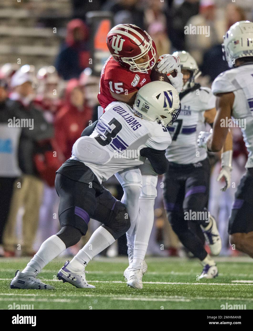 Indiana wide receiver Nick Westbrook (15) is hit by Northwestern ...