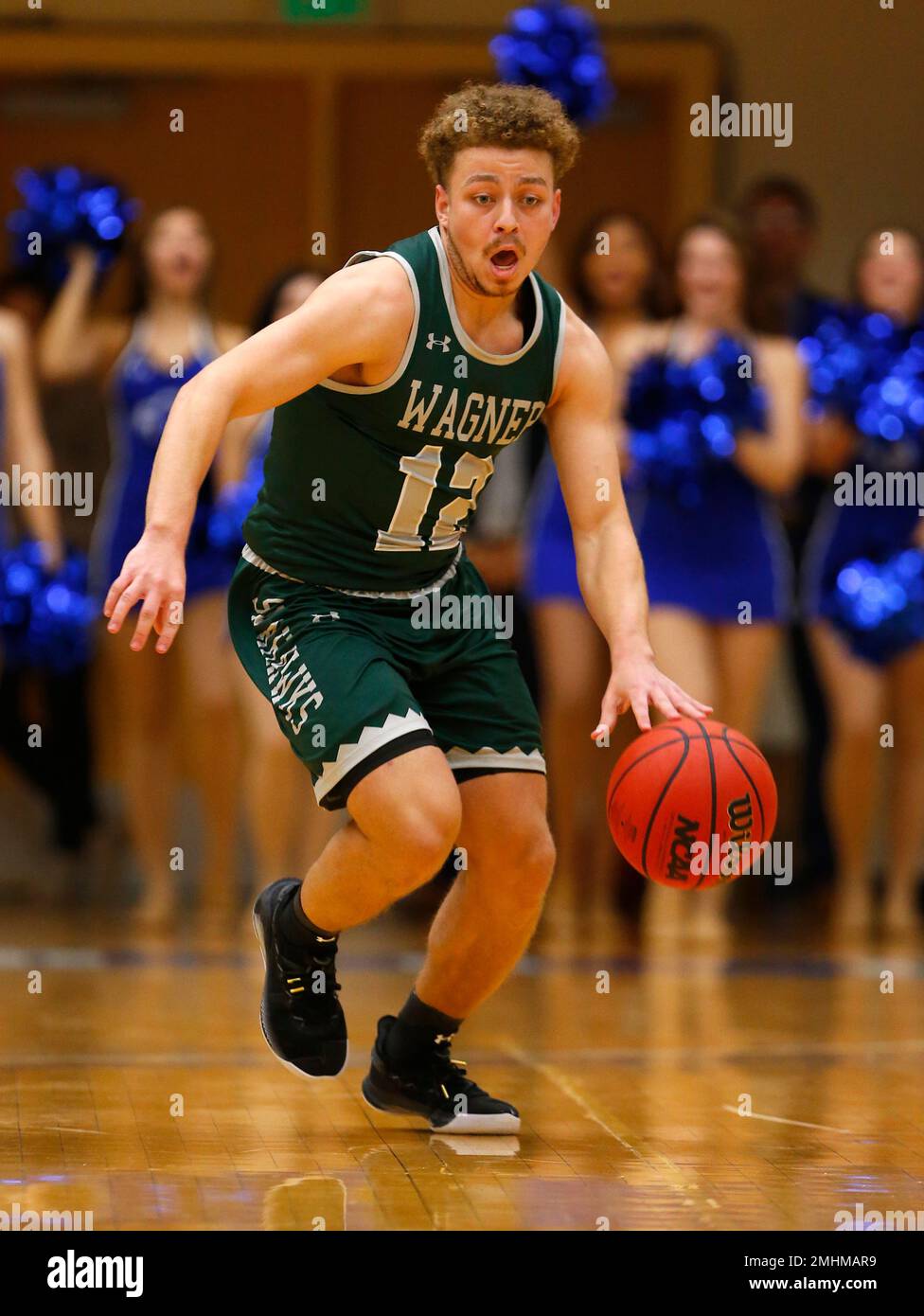 Wagner guard Chase Freeman (12) dribbles the ball against Seton Hall ...