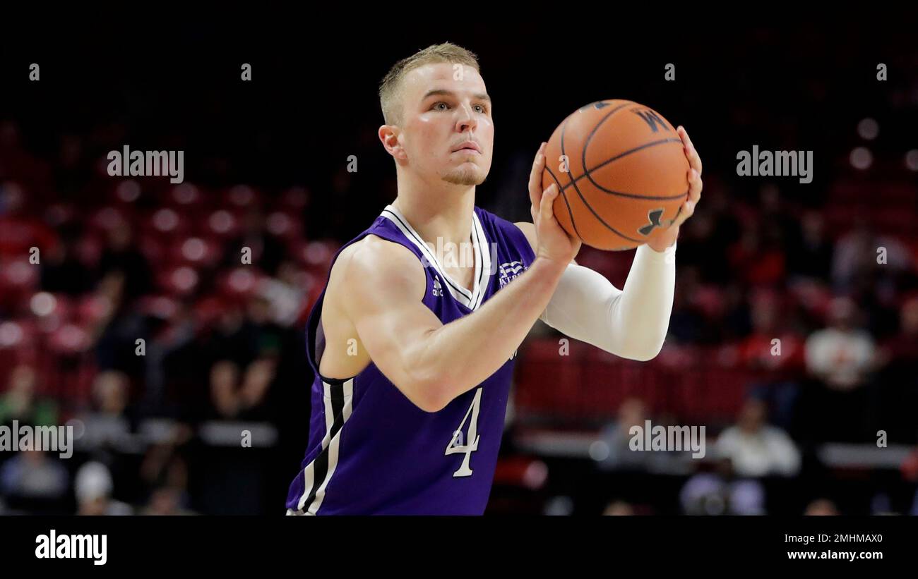Holy Cross guard Austin Butler prepares to shoot a basket against ...