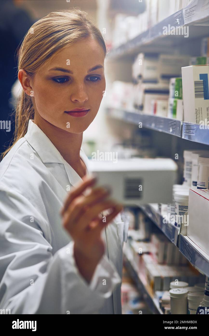 Positive young female pharmacist hi-res stock photography and images ...