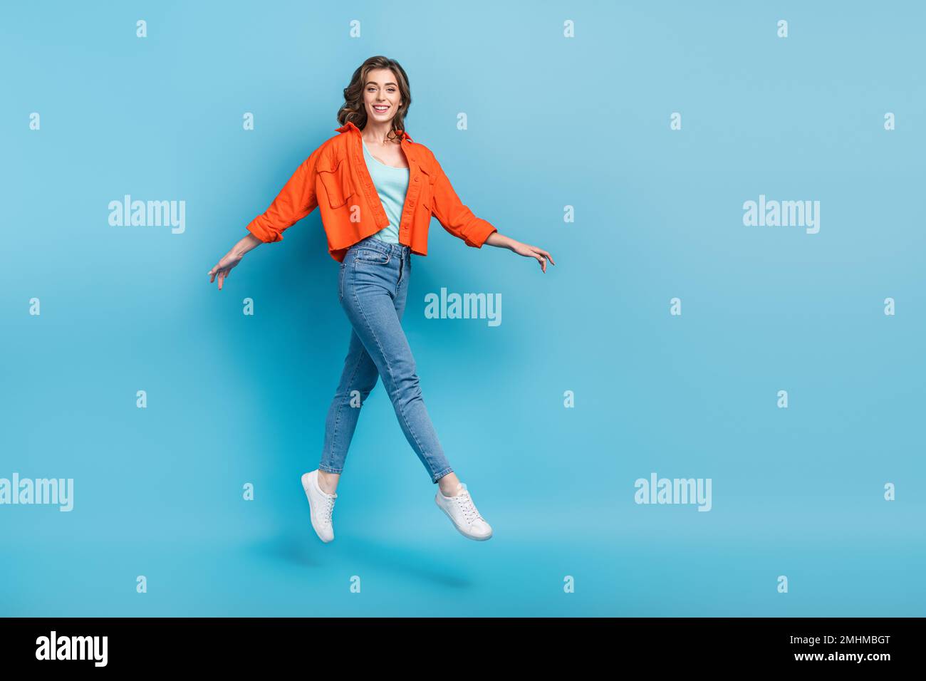 Full size photo of young pretty girl jumping walking elegant soar hover ...