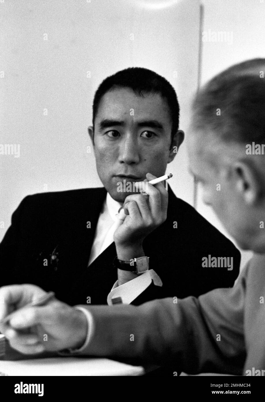 The Japanese writer Yukio Mishima, smoking, in Paris on Oct. 6, 1965 ...