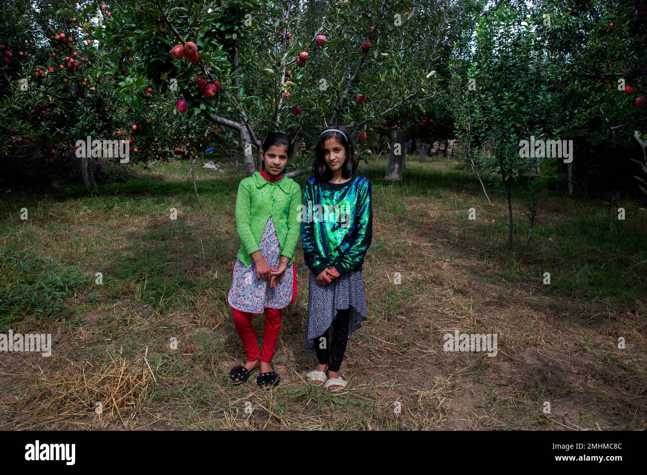 In this Oct. 6, 2019, photo, twin sisters Tabeer Shafi Bhat, right, and Taseer Shafi Bhat stand ...