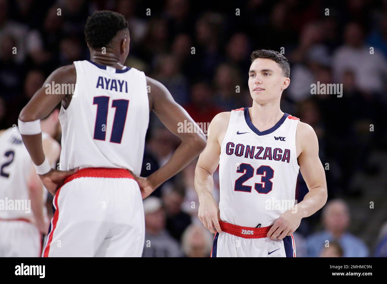 Gonzaga guard Matthew Lang (23) speaks with teammate Joel Ayayi (11 ...