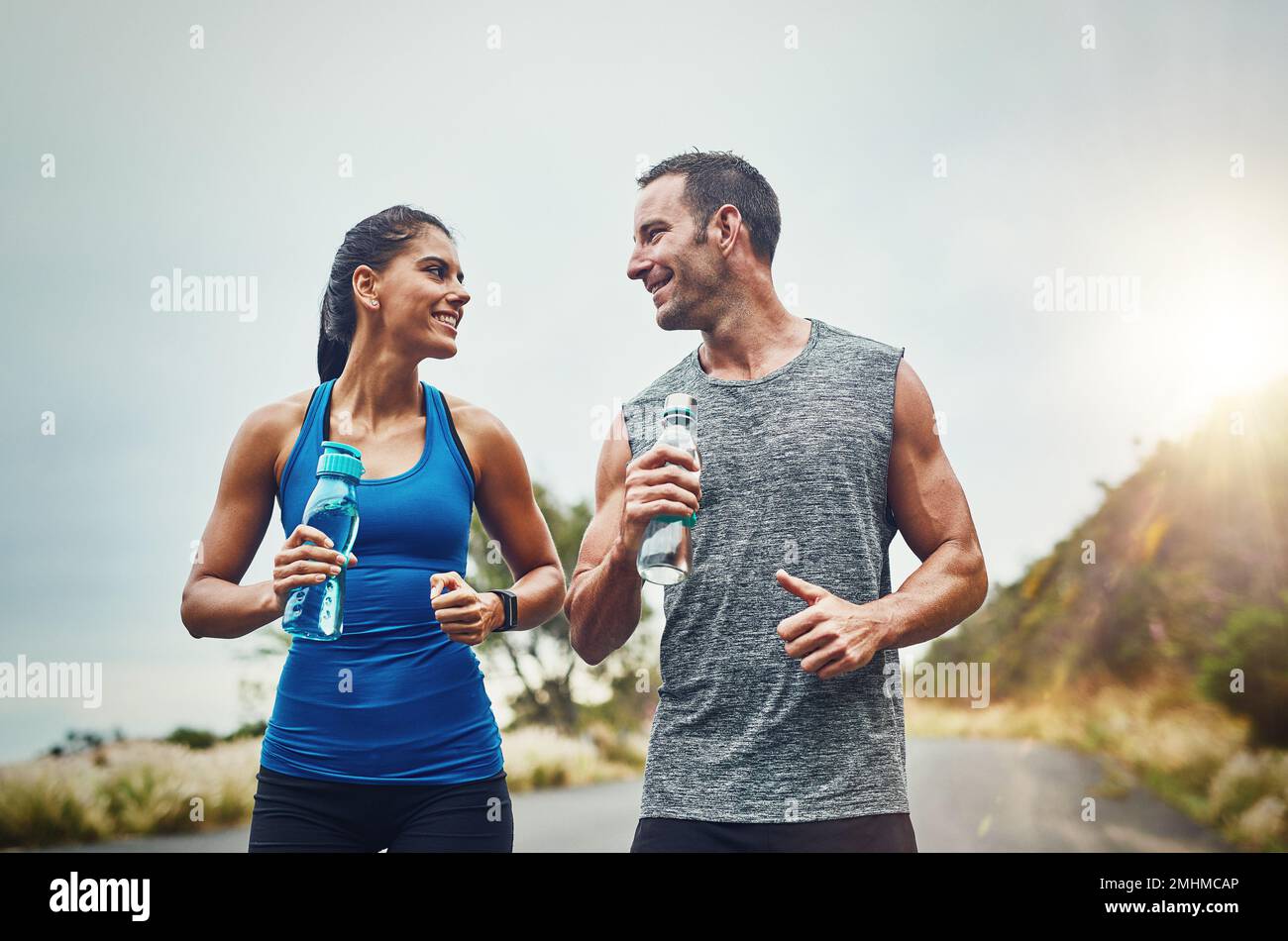 Quench your thirst then get back to it. a young attractive couple ...