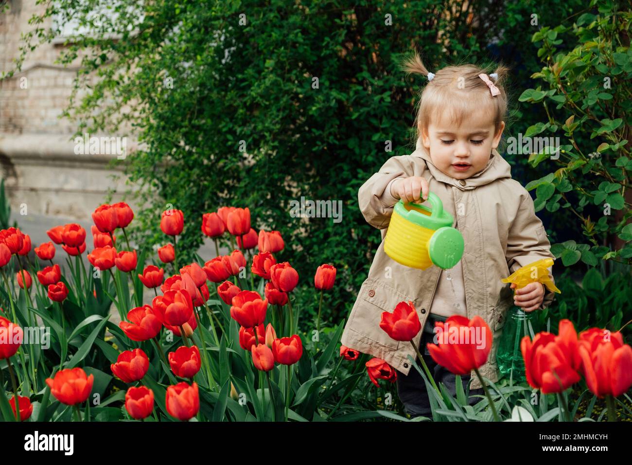 Spring Gardening Activities for Kids. Cute toddler little girl in ...