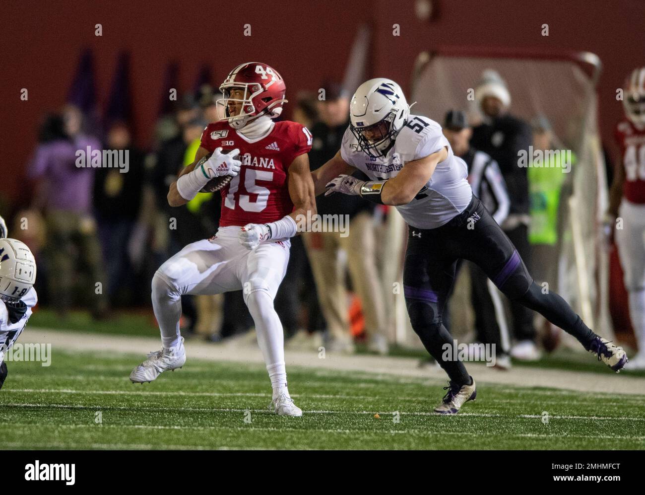 Indiana wide receiver Nick Westbrook (15) is hit by Northwestern ...
