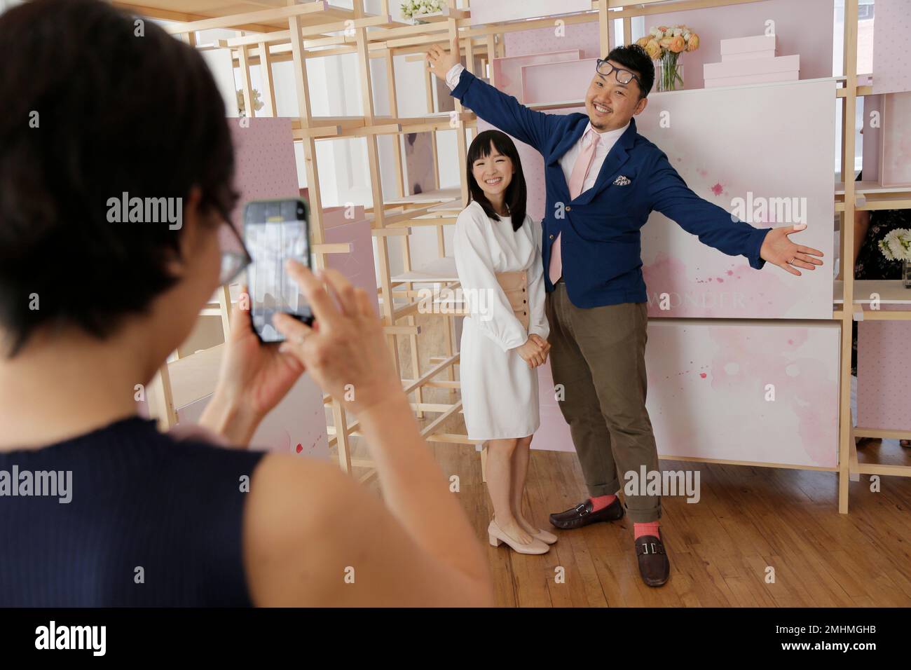 Marie Kondo, and her husband, Takumi Kawahara, pose for a picture after ...