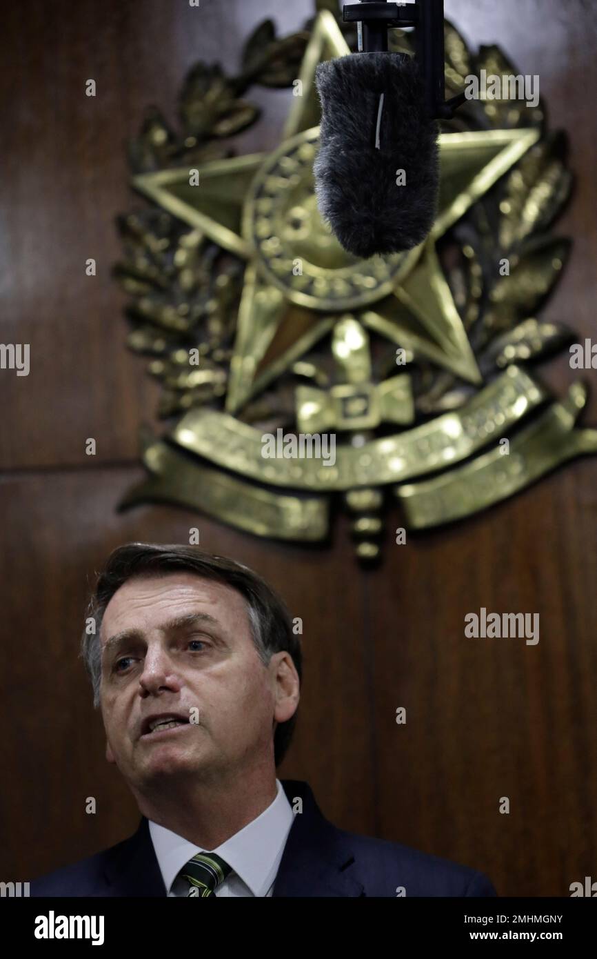 Brazil's President Jair Bolsonaro speaks during the delivery of his ...