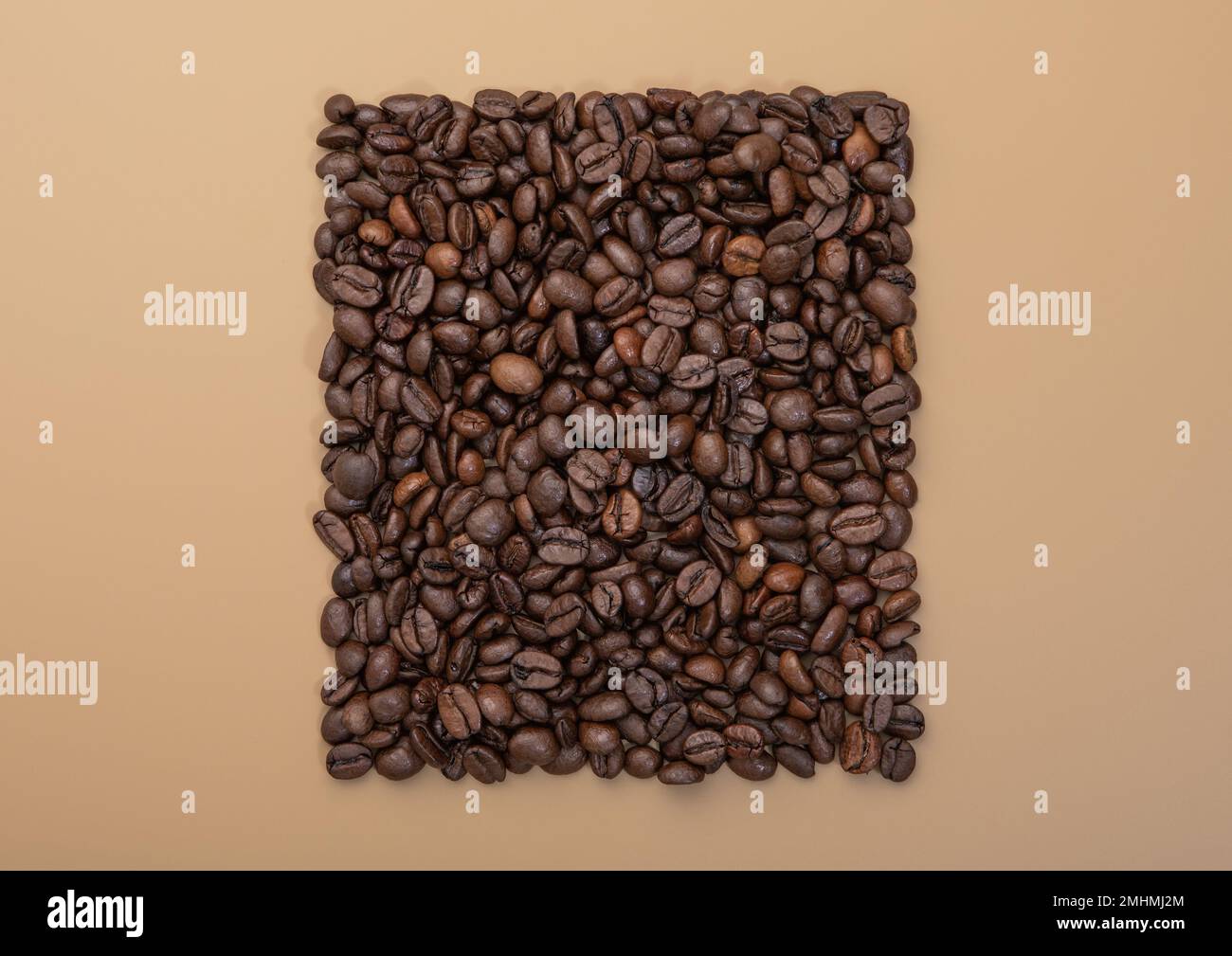 Square of fresh raw coffee beans on beige background.Top view Stock ...