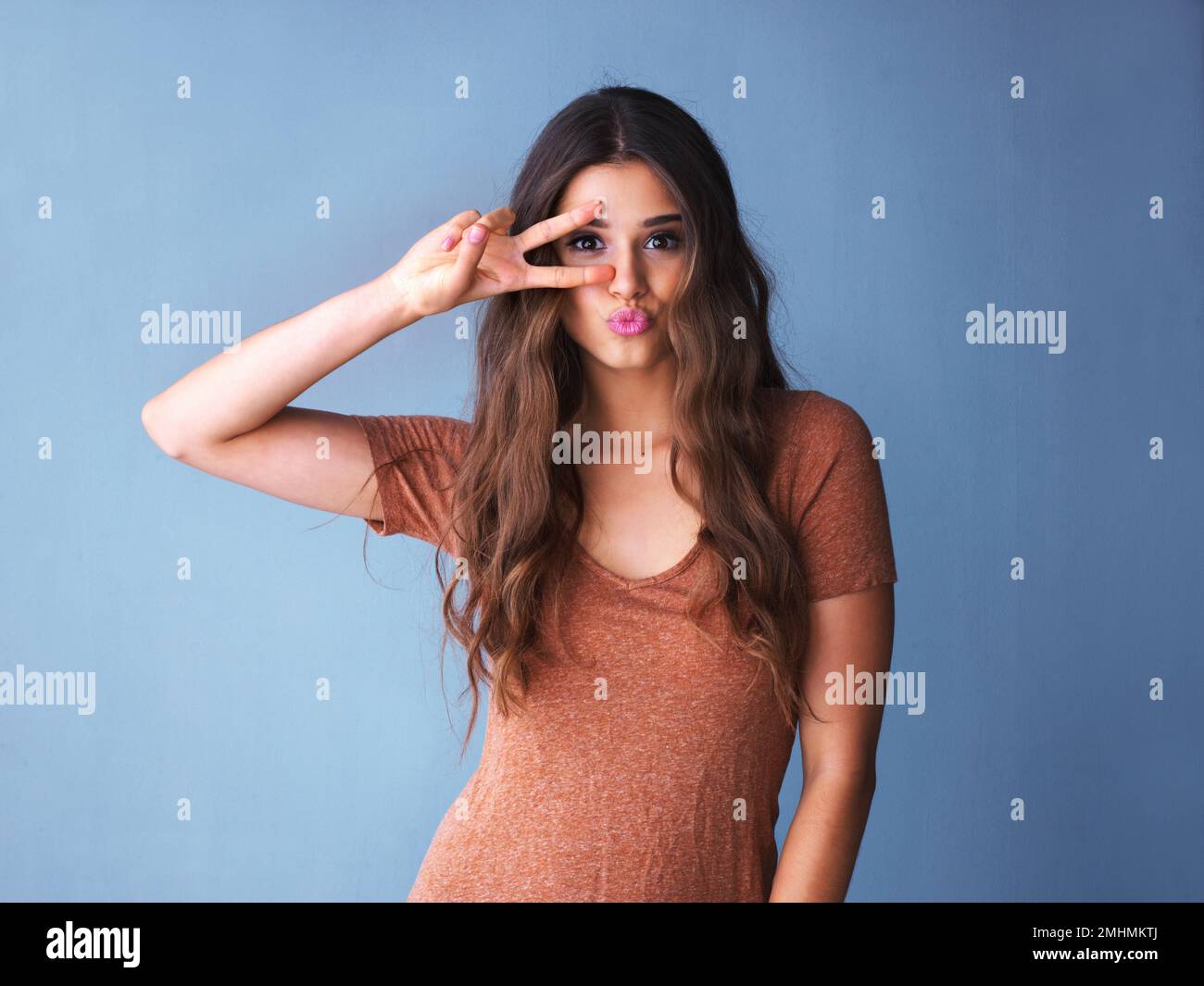 Yeah, Im cool like that. an expressive young woman posing against a ...