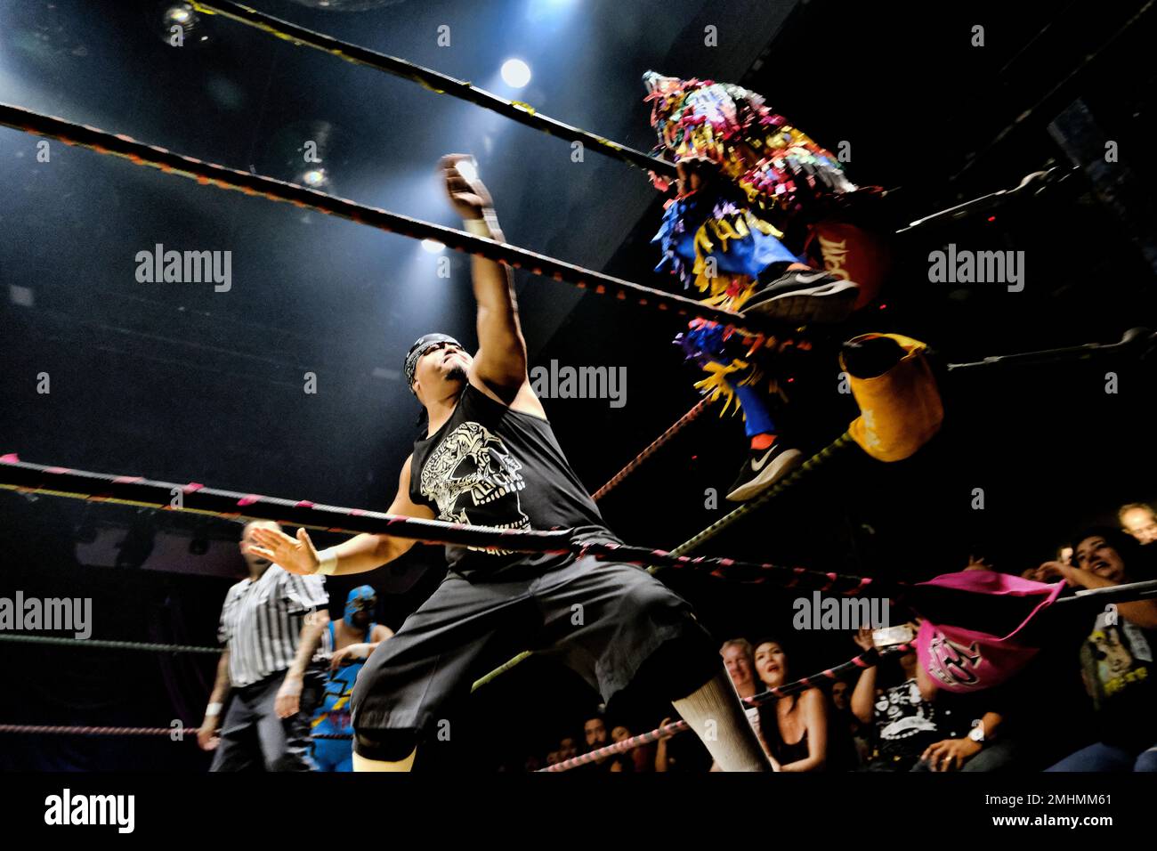 In this Thursday, Oct. 24, 2019 photo, Lucha wrestler Lil Cholo, left ...