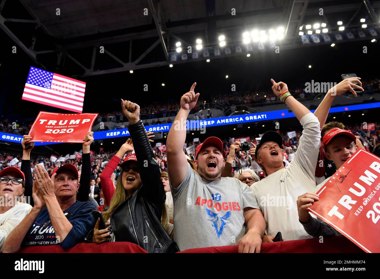 Supporters cheer as President Donald Trump speaks during a campaign ...