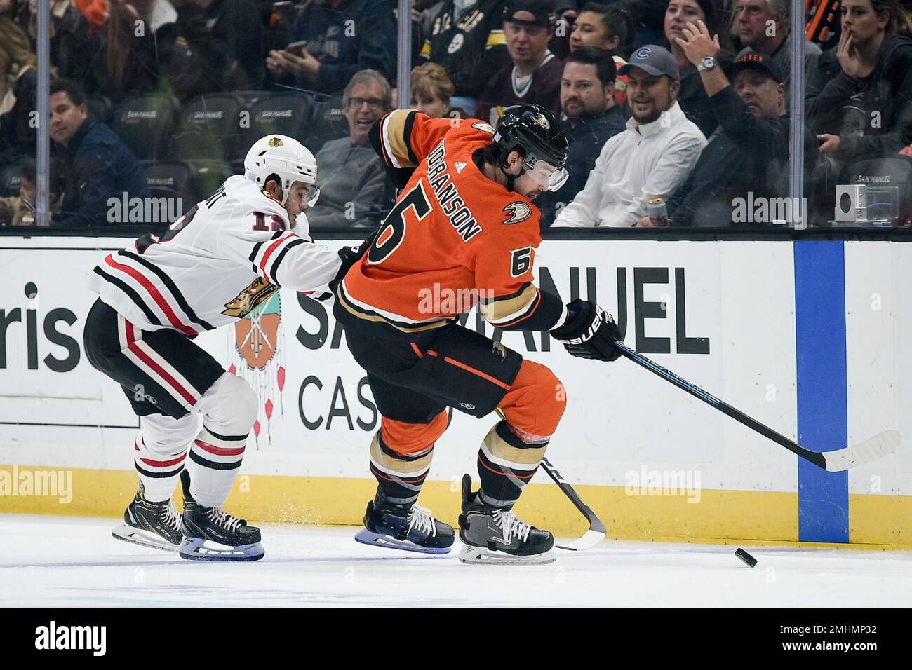 Anaheim Ducks defenseman Erik Gudbranson, right, moves the puck while ...
