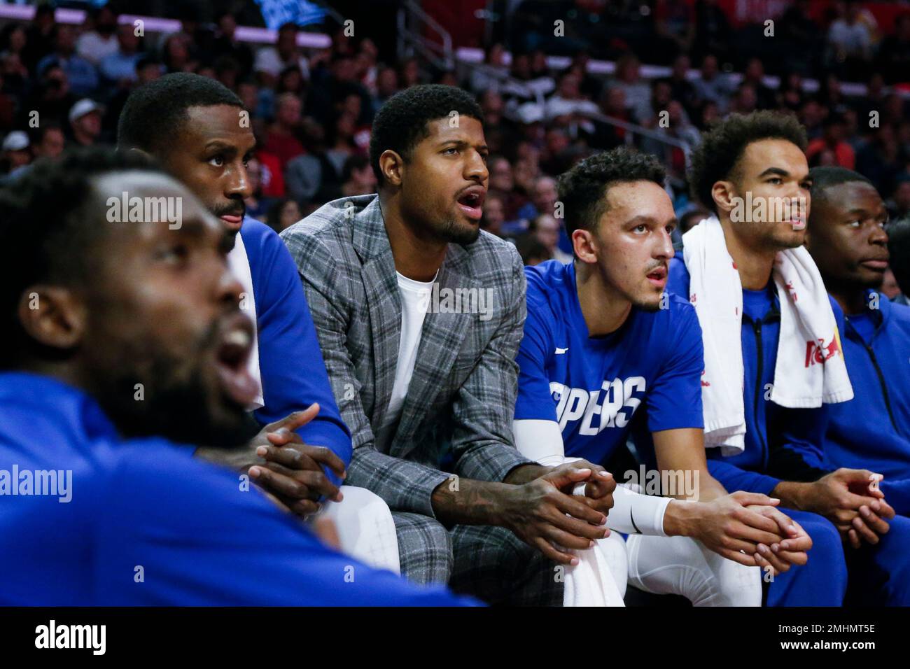 Los Angeles Clippers' Paul George (13) watches on the bench during an ...
