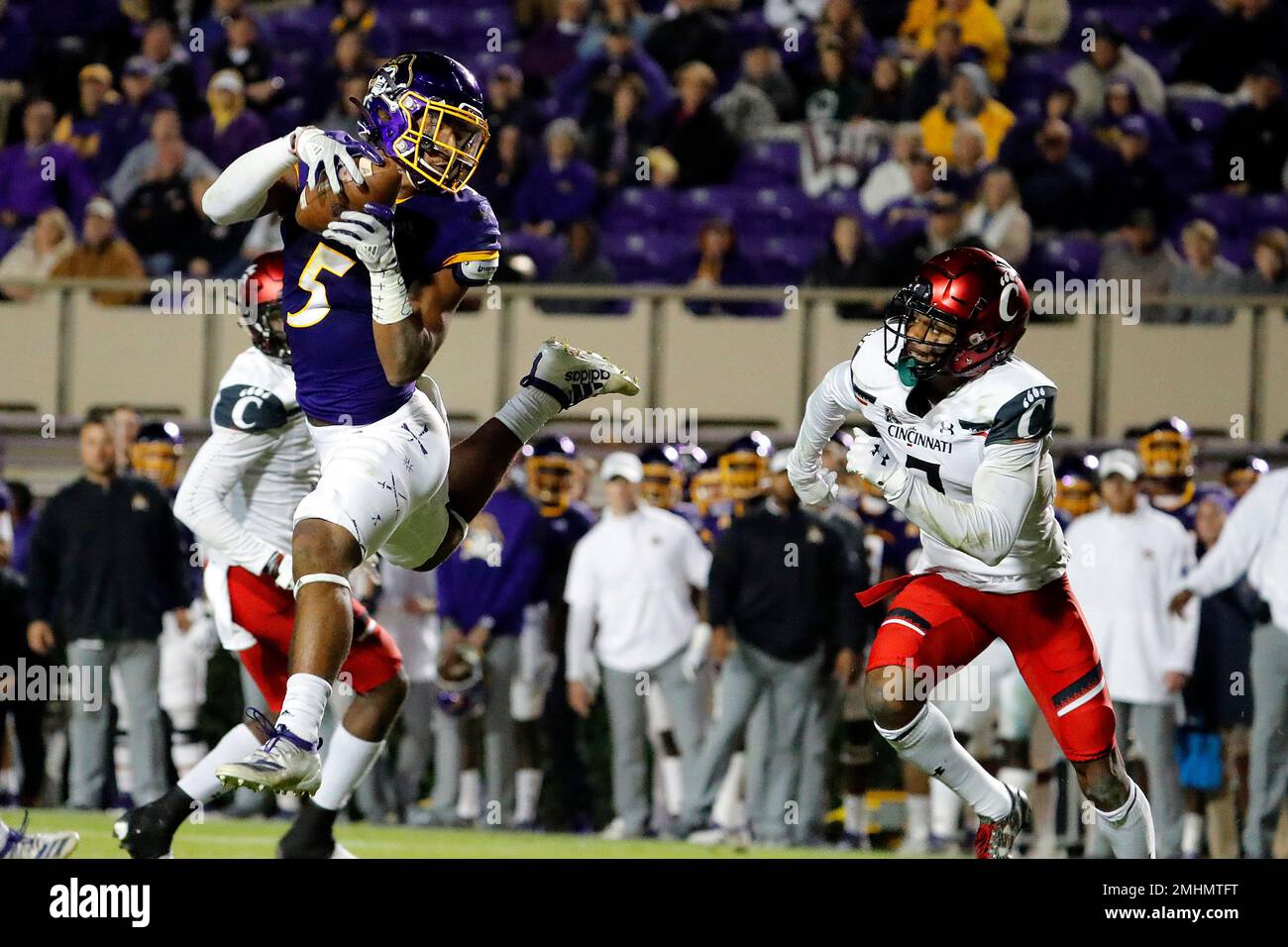 East Carolina's C.J. Johnson (5) catches the ball over Cincinnati's ...