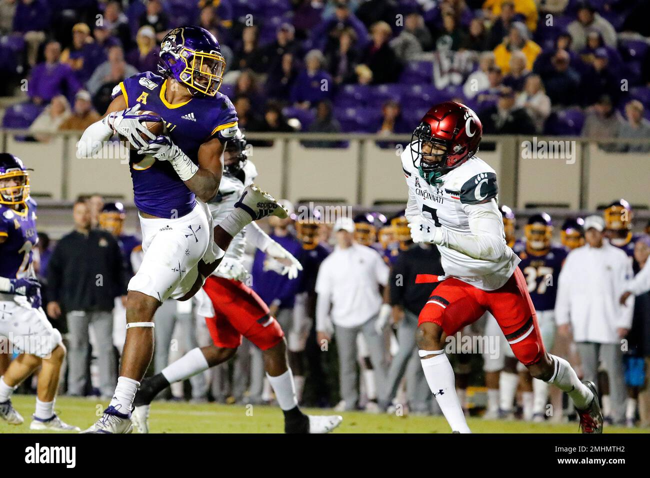 East Carolina's C.J. Johnson (5) catches the ball over Cincinnati's ...