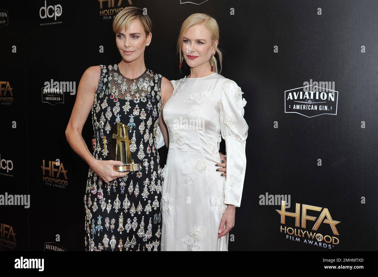 Charlize Theron, left, winner of the Hollywood career achievement award ...