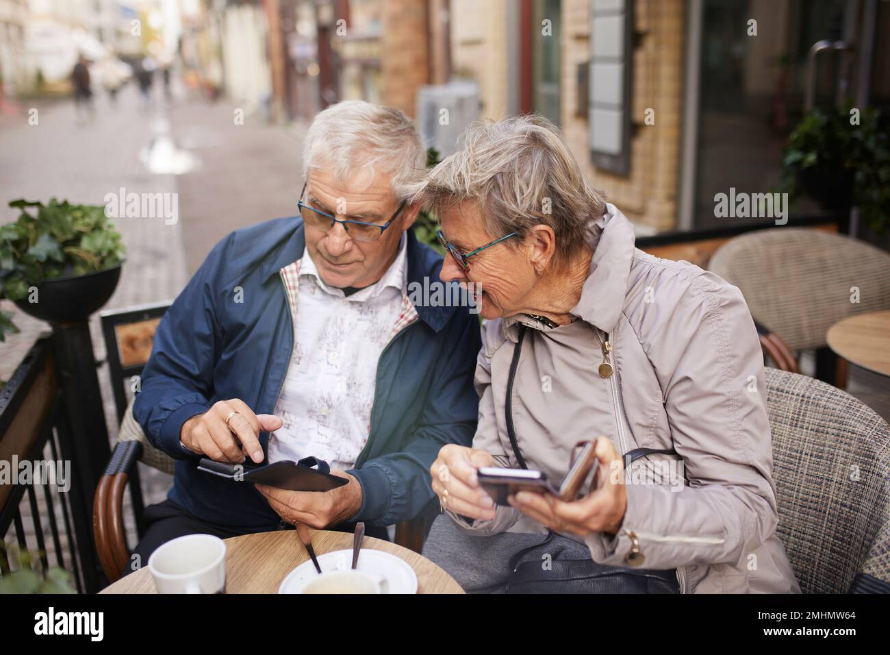 Middle aged couple using wireless hi-res stock photography and images ...