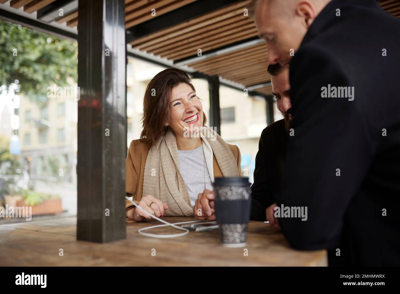 Smiling business people talking together Stock Photo - Alamy