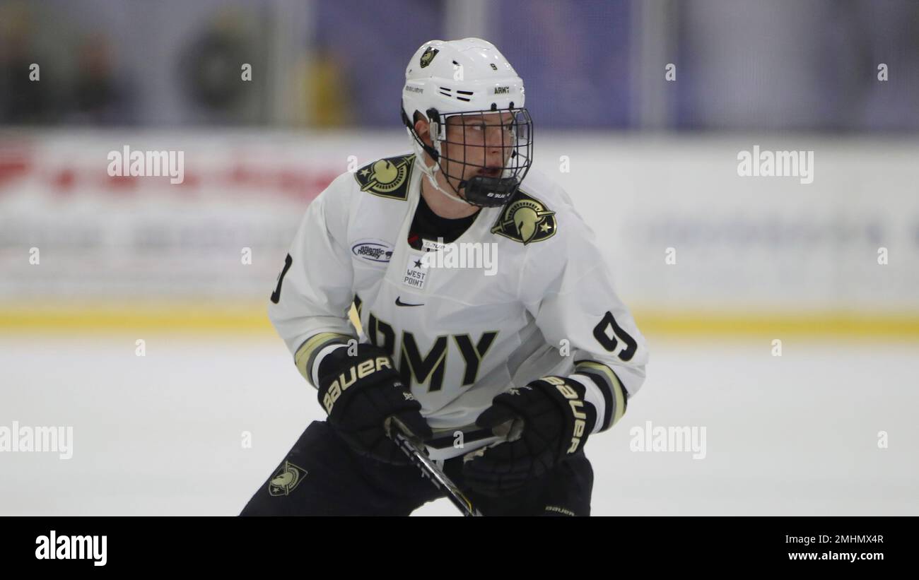 Army forward Daniel Haider (9) watches the puck during an NCAA college ...