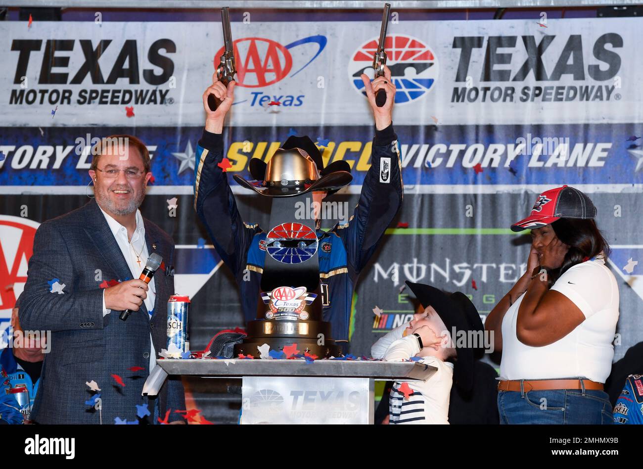 Kevin Harvick, obscured, celebrates in Victory Lane after winning a ...