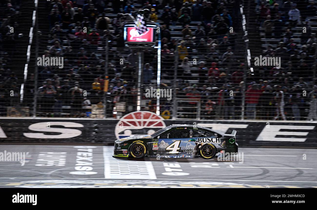 Kevin Harvick (4) crosses the finish line to win a NASCAR Cup Series ...