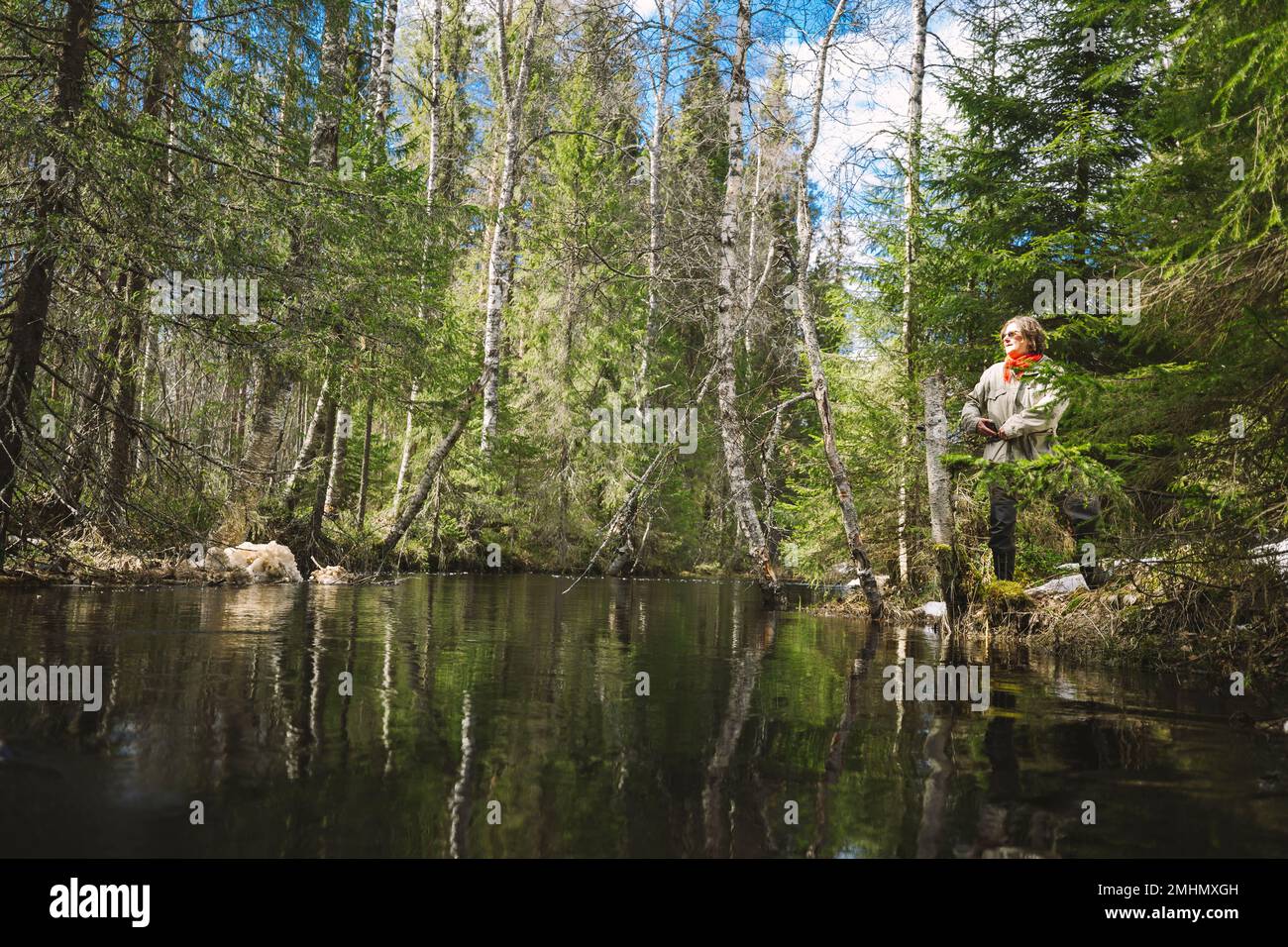 Lady on riverbank hi-res stock photography and images - Alamy