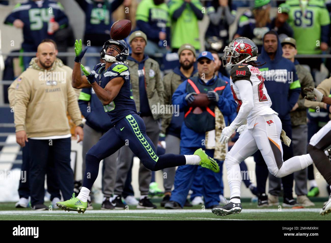 Seattle Seahawks wide receiver Tyler Lockett, left, catches a pass ...