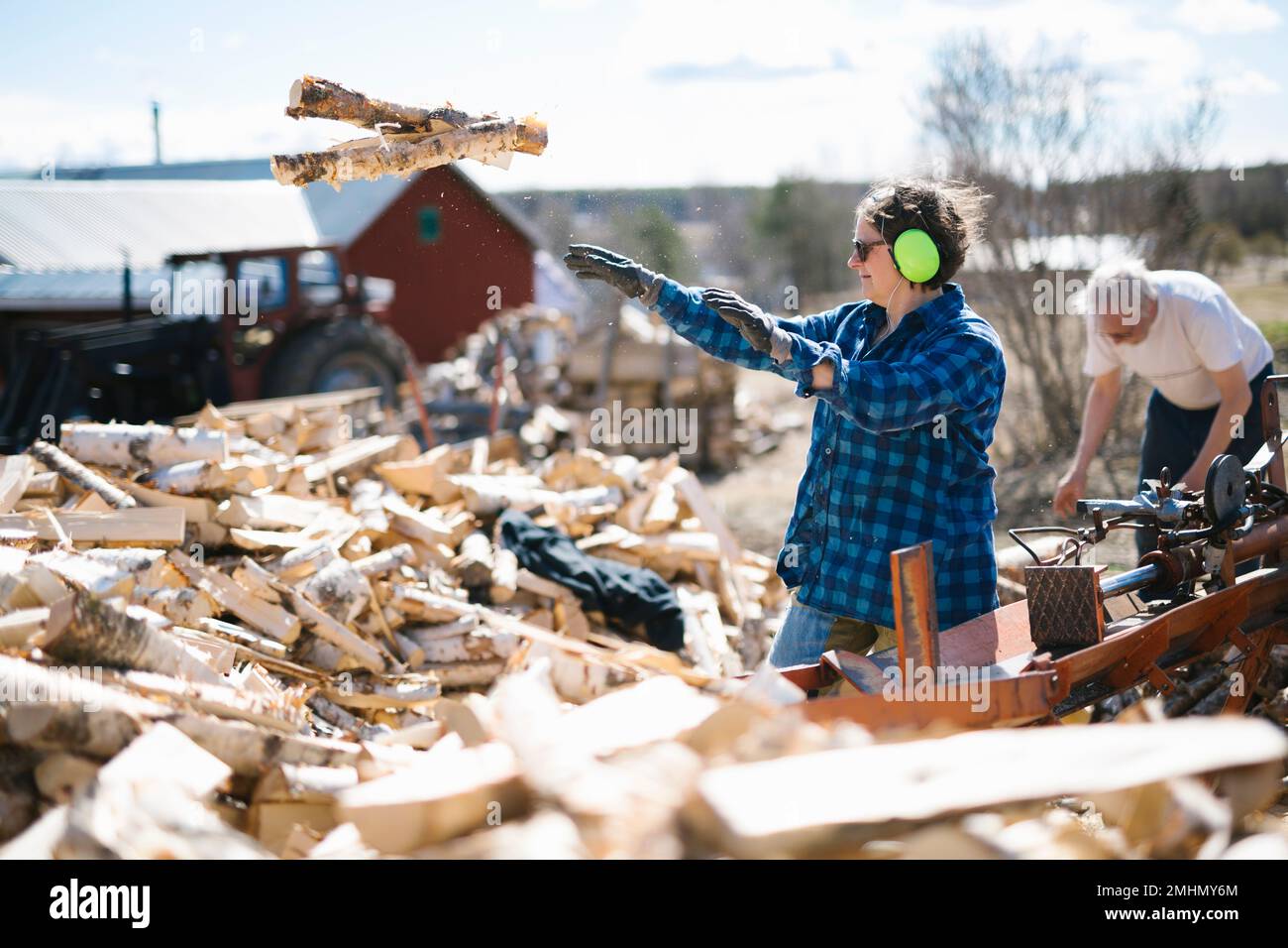 Mature woman working in sawmill Stock Photo - Alamy