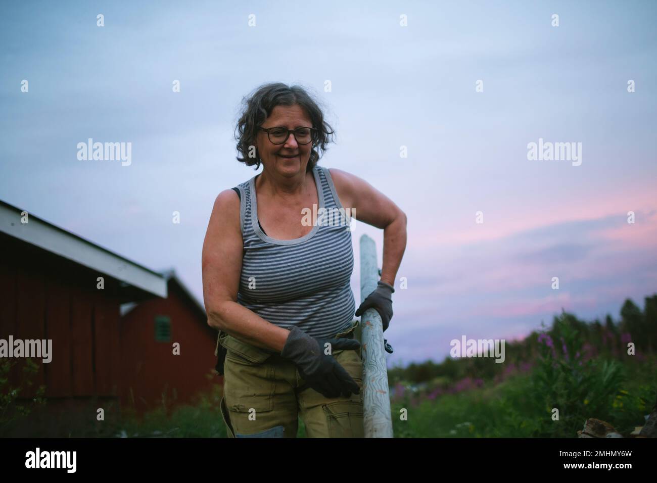 Mature woman working in garden Stock Photo - Alamy