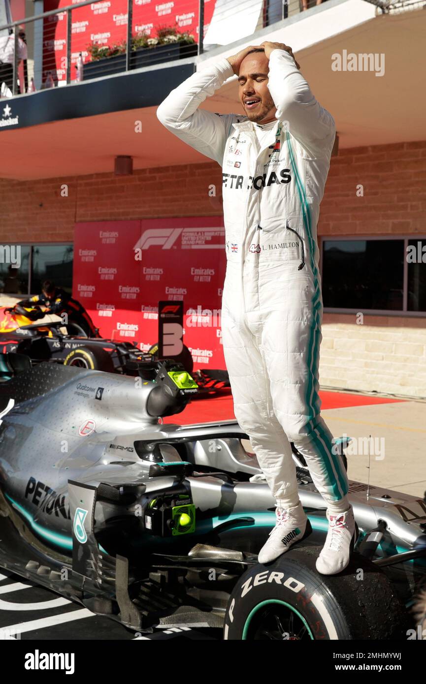 Mercedes driver Lewis Hamilton, of Britain, reacts following the ...