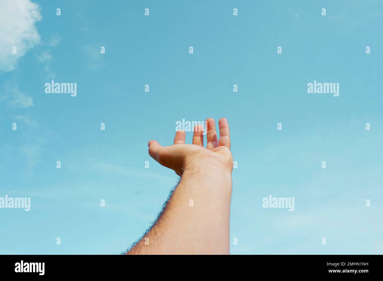 hand up gesturing in the blue sky, feelings and emotions Stock Photo ...