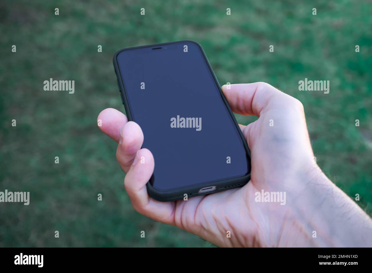 hand holding a smartphone, mobile addiction Stock Photo - Alamy