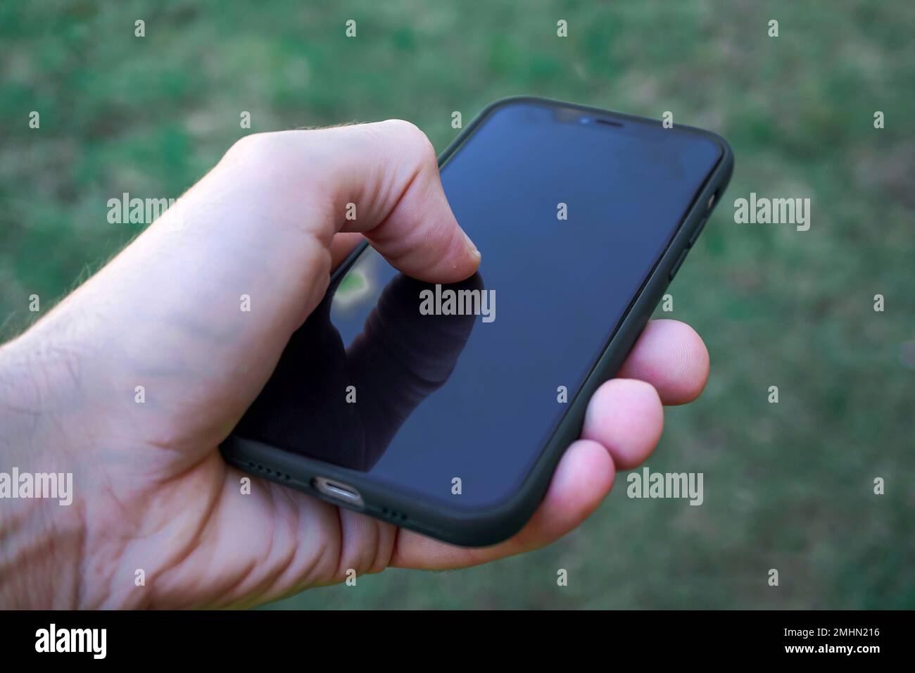 hand holding a smartphone, mobile addiction Stock Photo - Alamy