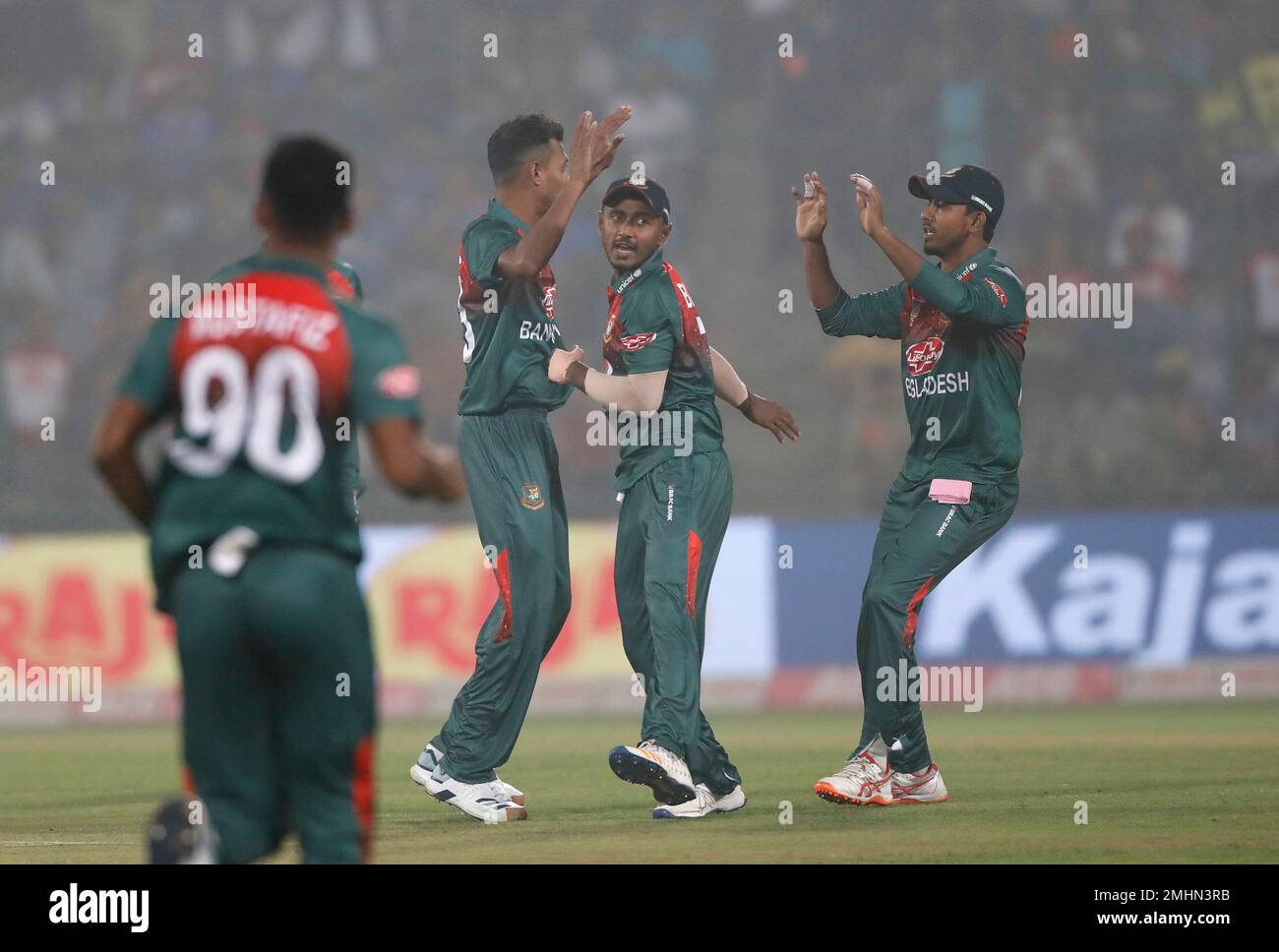 Bangladesh's Shaiful Islam, second left, celebrates the wicket of India ...